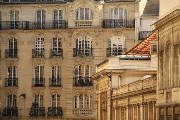 Facade of a classic apartments block in Paris - Stock Image - Everypixel