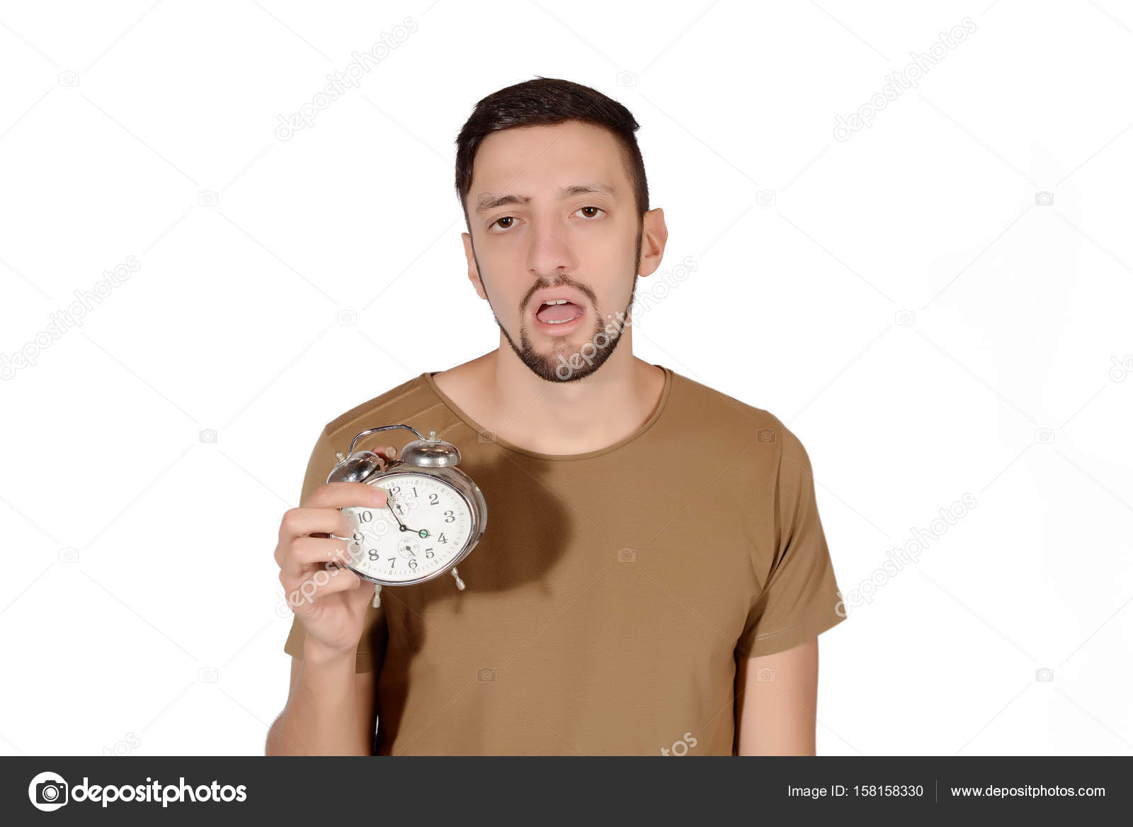 Man with alarm clock. Stock Photo by ©nicomenijes 158158330
