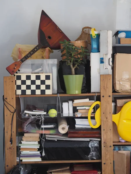 Boxes with old things, with parts for filming, accessories on shelves ...