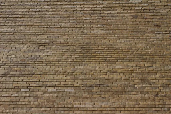 Upward view of an attractive light tan color brick wall texture ...