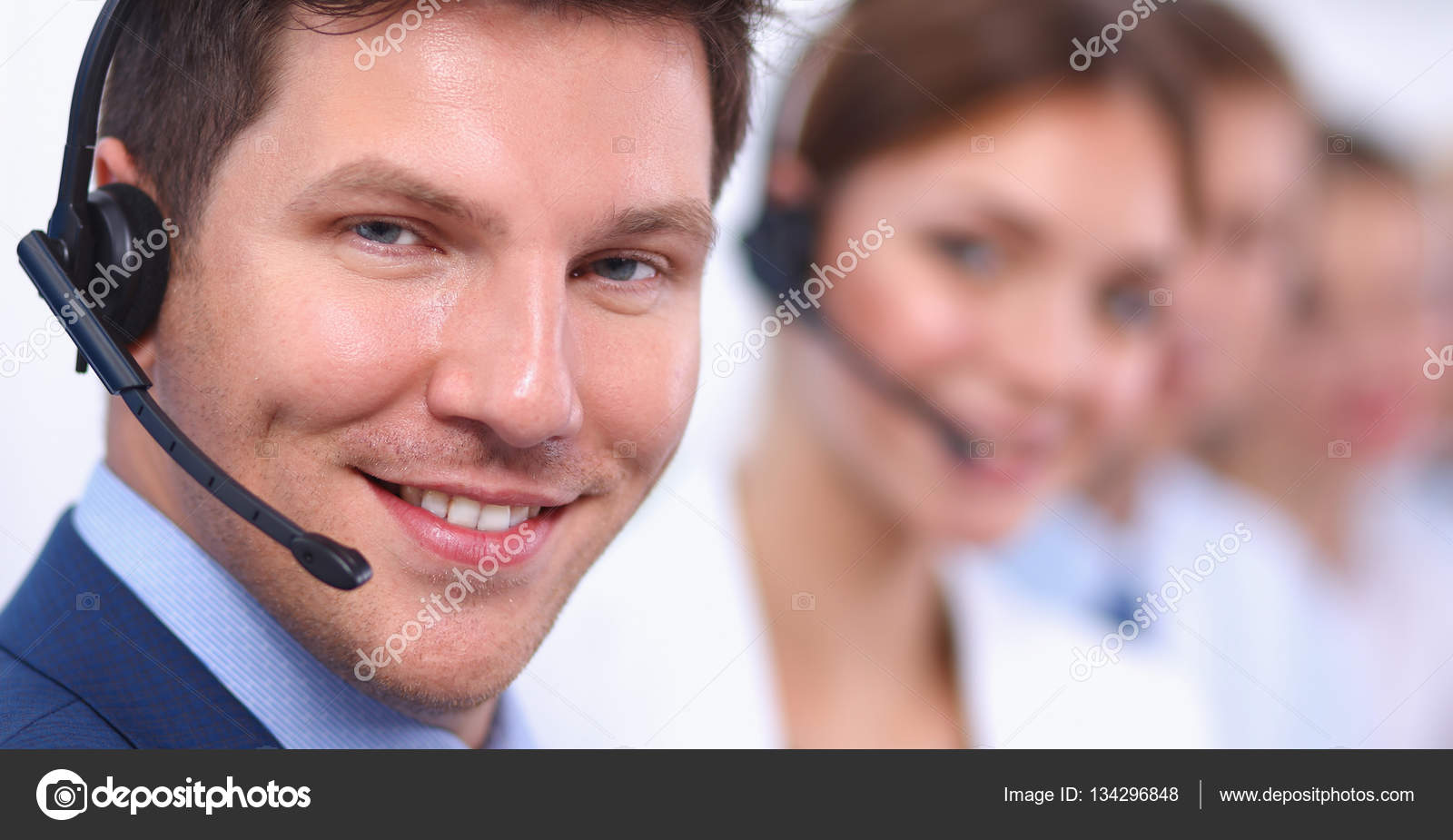 Attractive Smiling positive young businesspeople and colleagues in a ... Attractive Smiling positive young businesspeople and colleagues in a ...