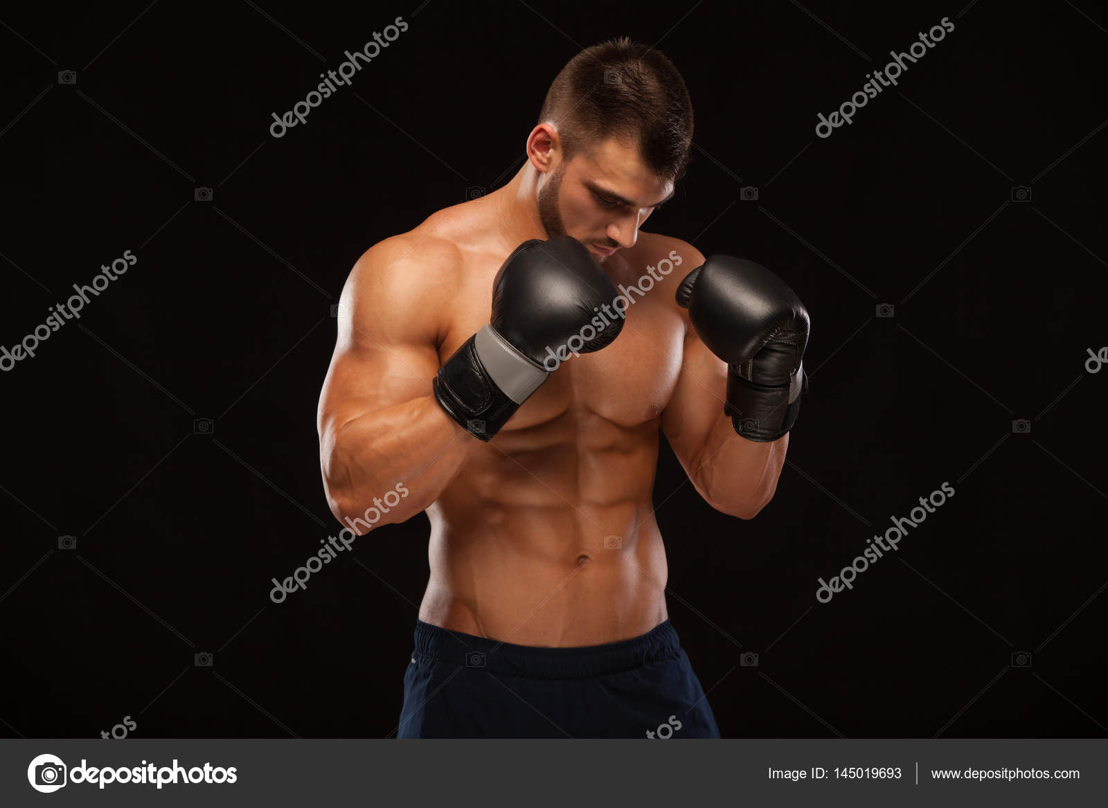 Muscular young man with perfect Torso with six pack abs, in boxing ...