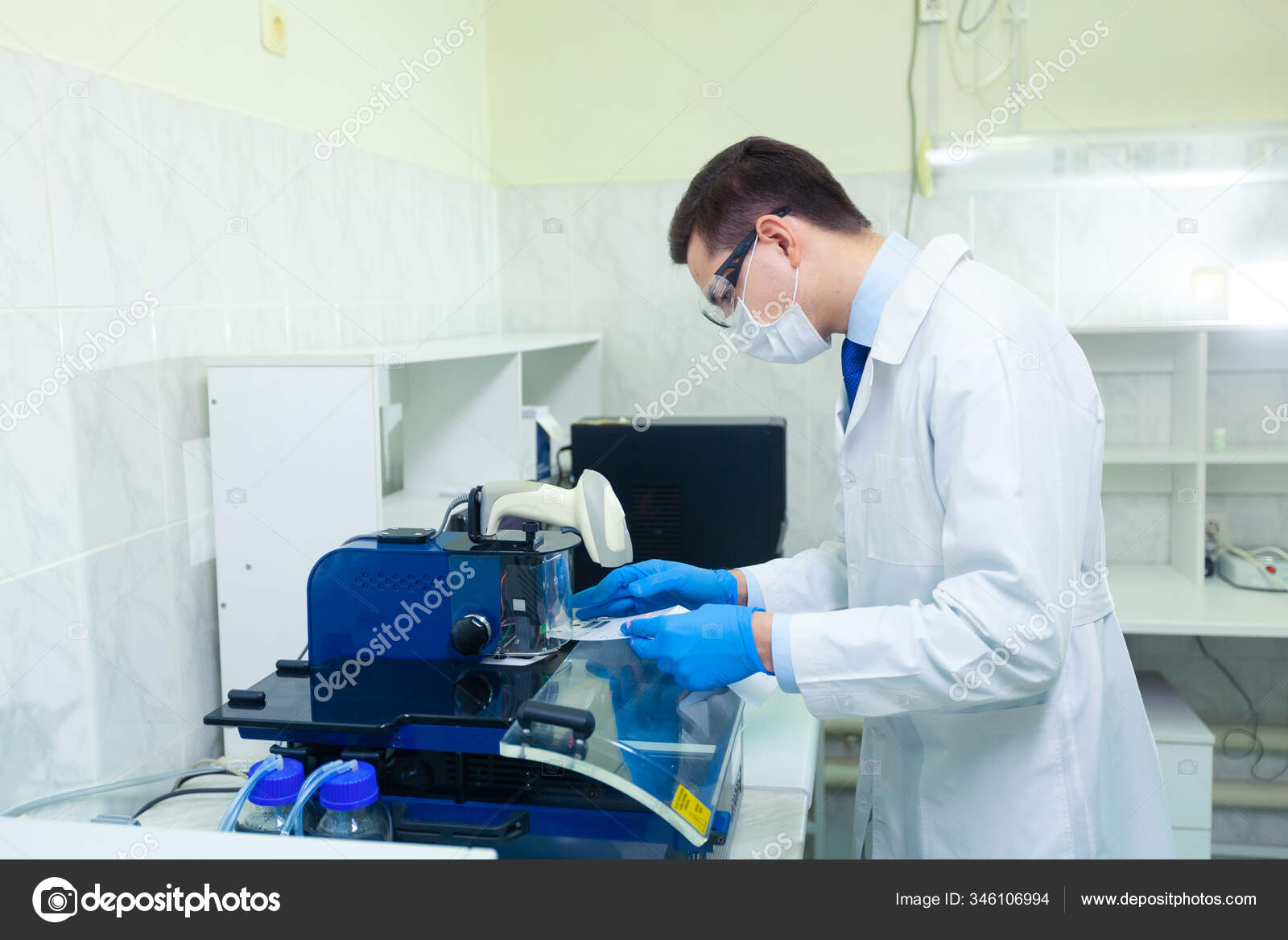 DNA laboratory. The expert puts the human DNA into the database using ...