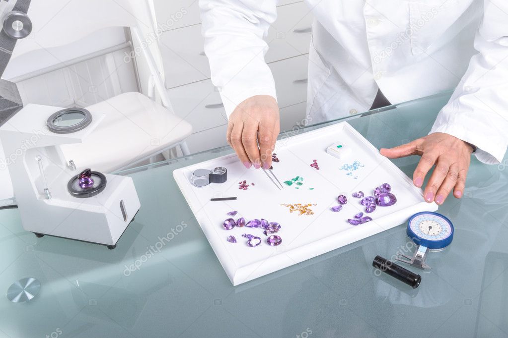 The Gemologist Woman Expertise. Stock Photo by ©osmar01 126807572