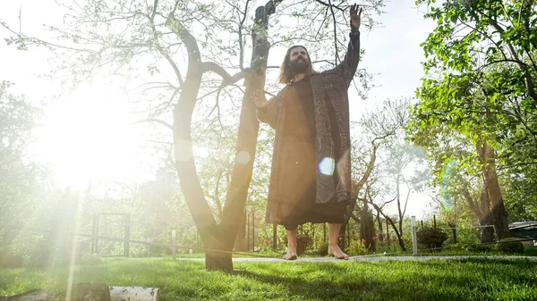 A qigong master walks on a rope keeping his balance - Stock Image ...