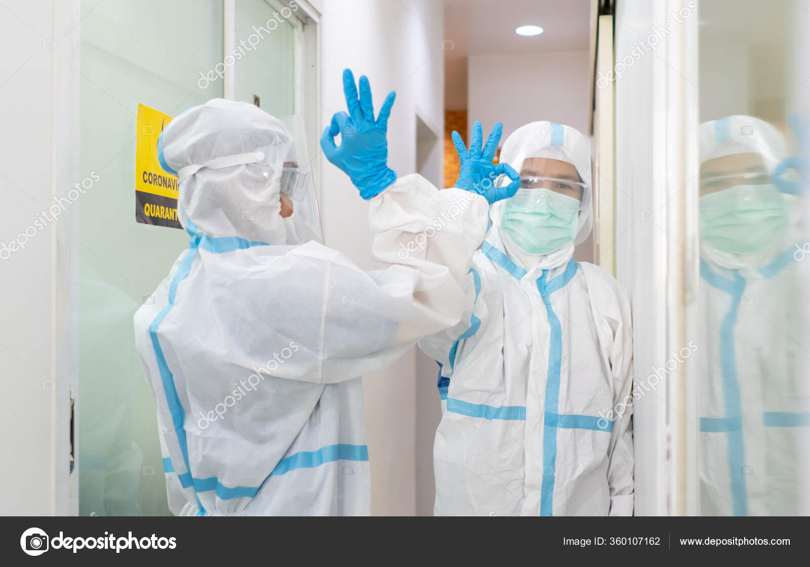 Two Doctors Personal Protective Equipments Greeting Each Other Touching ...