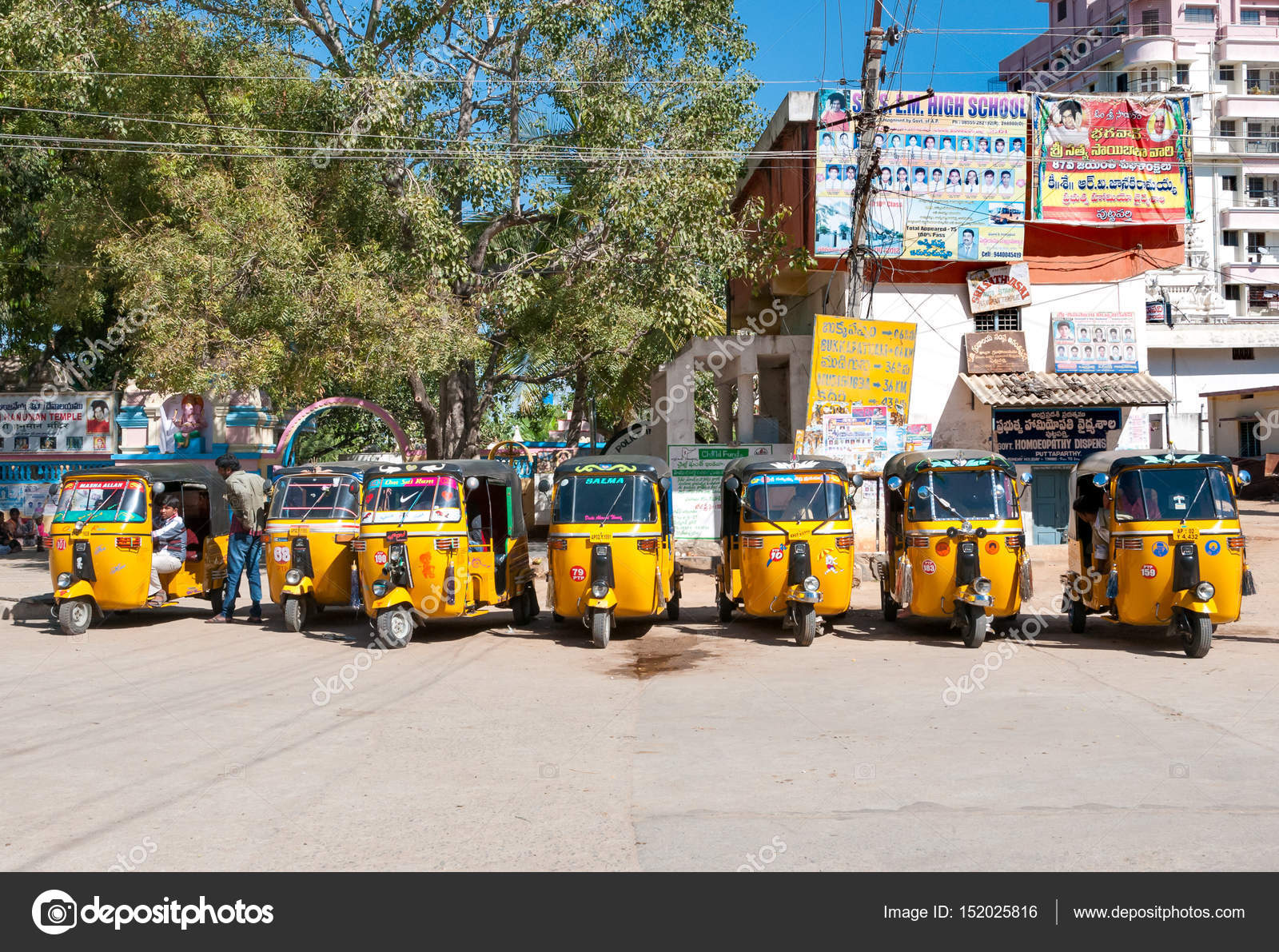 Yellow rickshaw taxis on a road in Puttaparthi village. — Stock ...