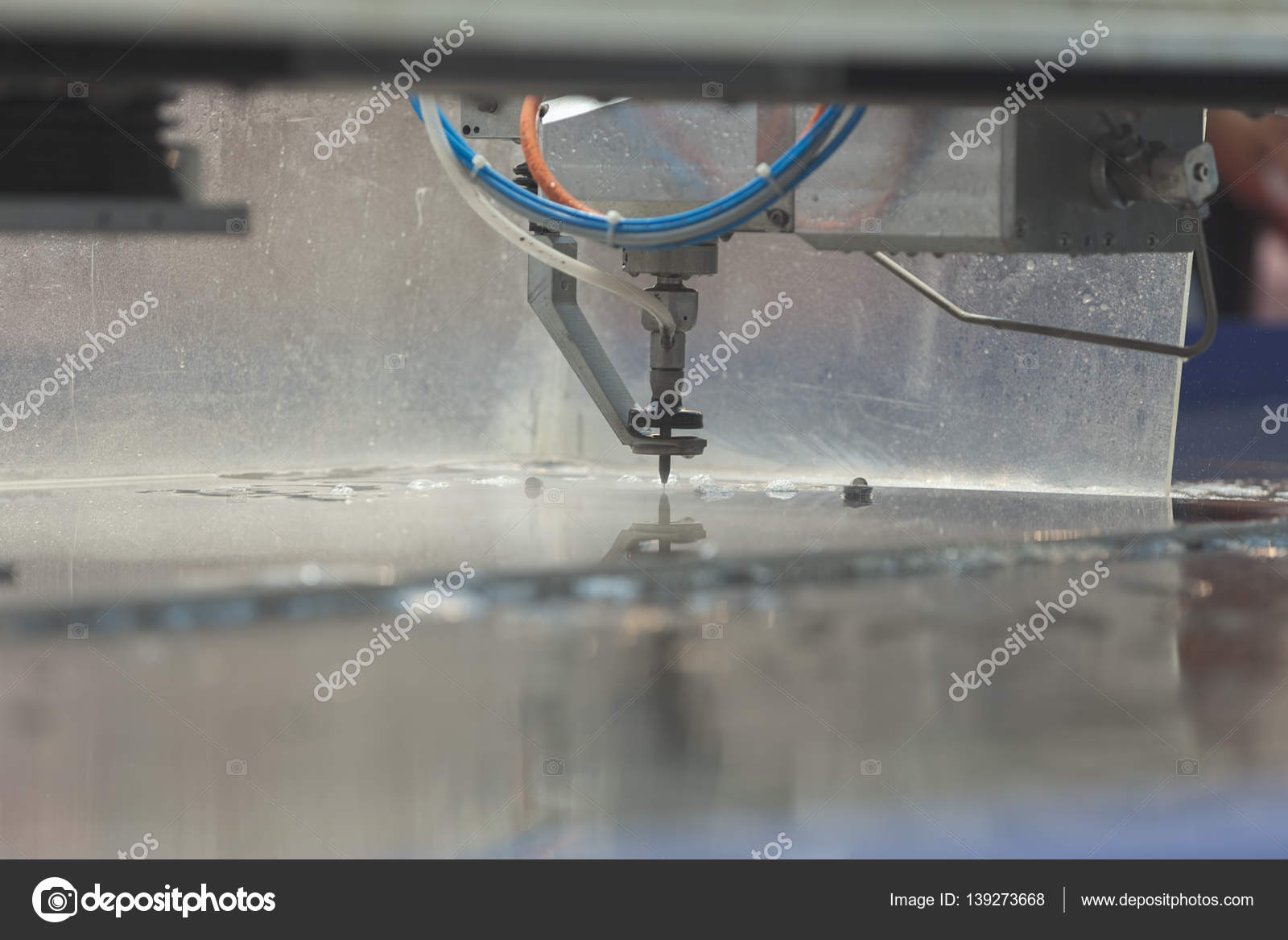Cnc water jet machine Stock Photo by ©VladimirNenezic 139273668