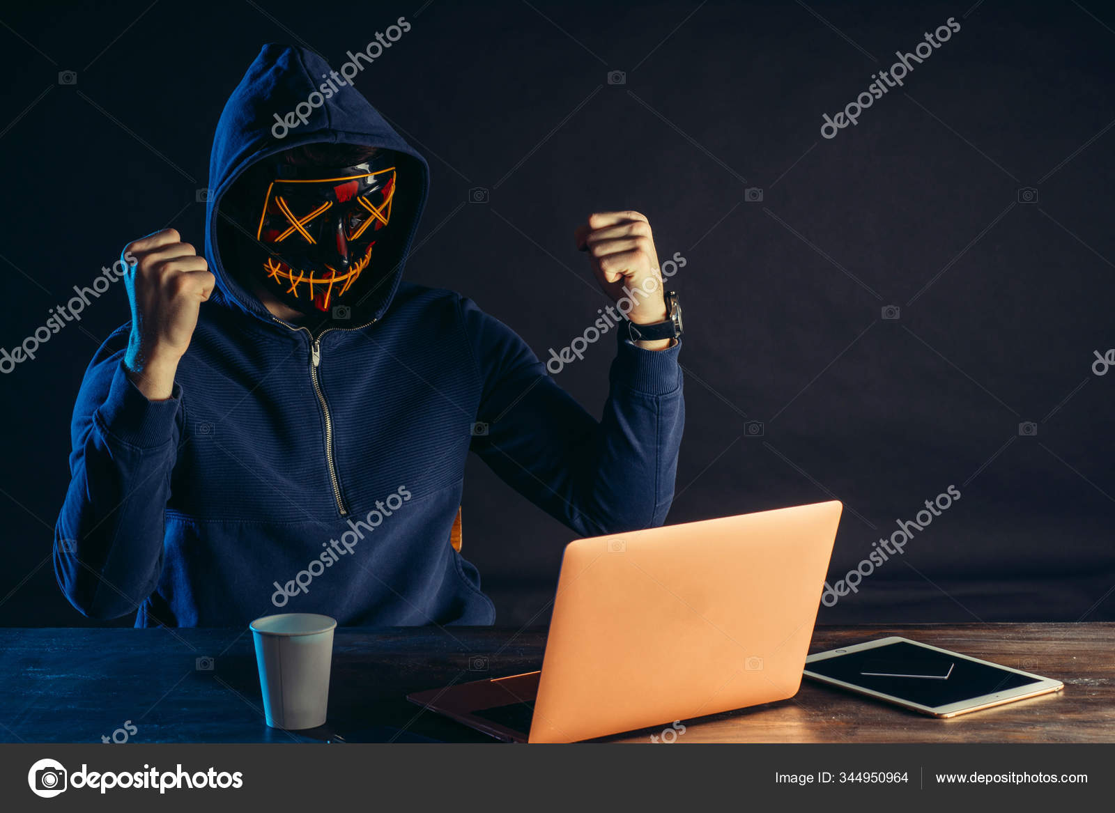 Happy hacker man rised hands up after successful ending of hacking ...
