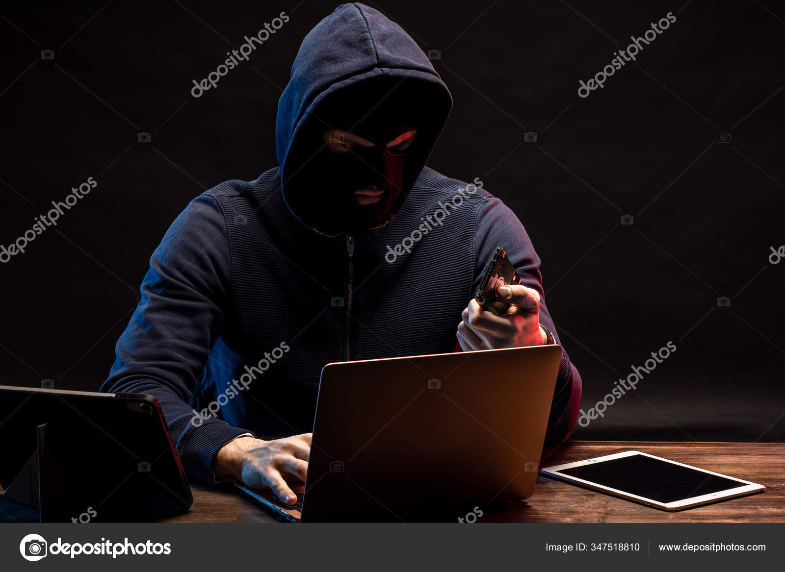 Anonymous hacker man isolated over dark space — Stock Photo ...