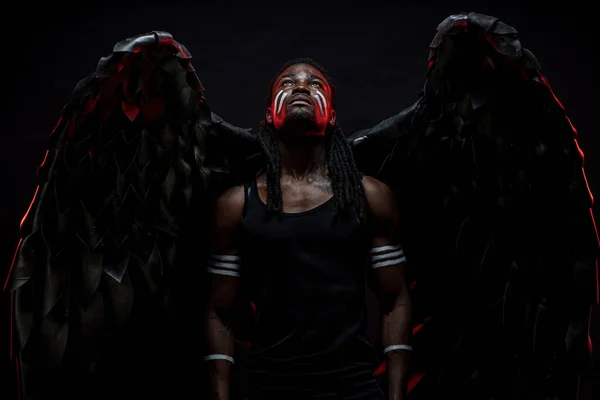 Tormented angel with black wings Stock Photo by ©romanchazov27 349200608