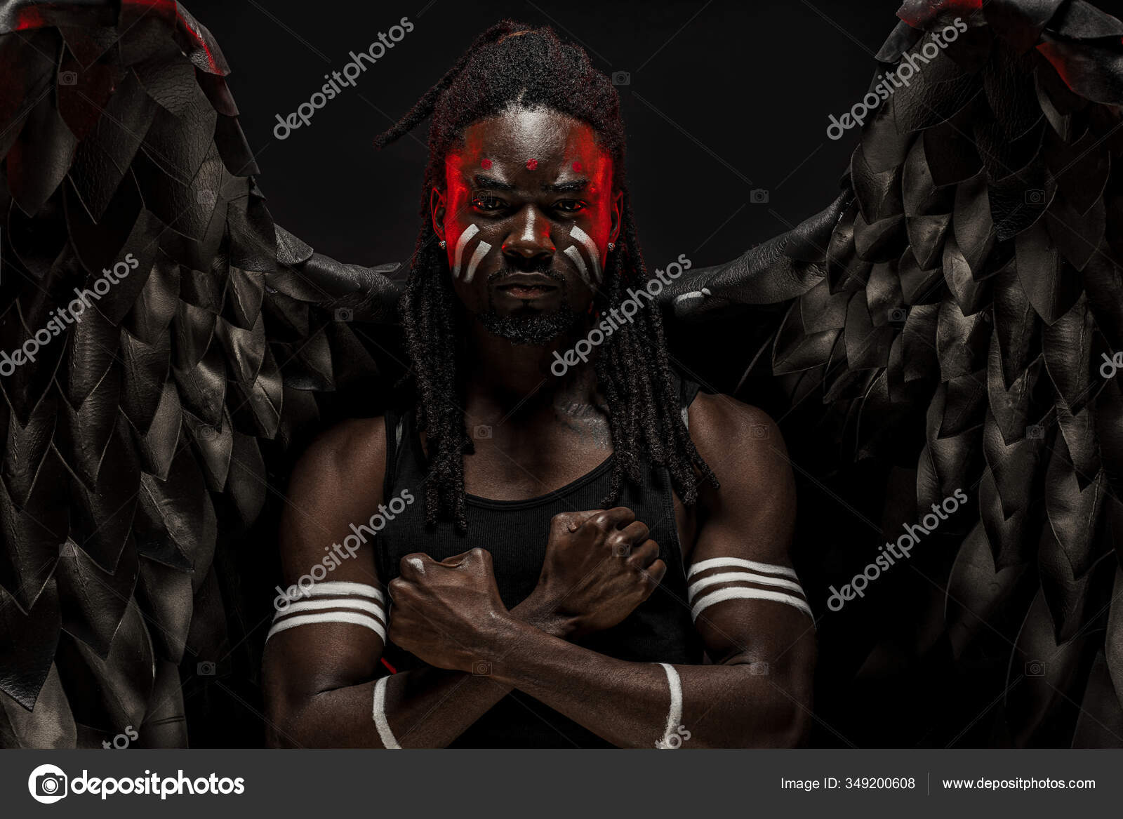 Tormented angel with black wings Stock Photo by ©romanchazov27 349200608