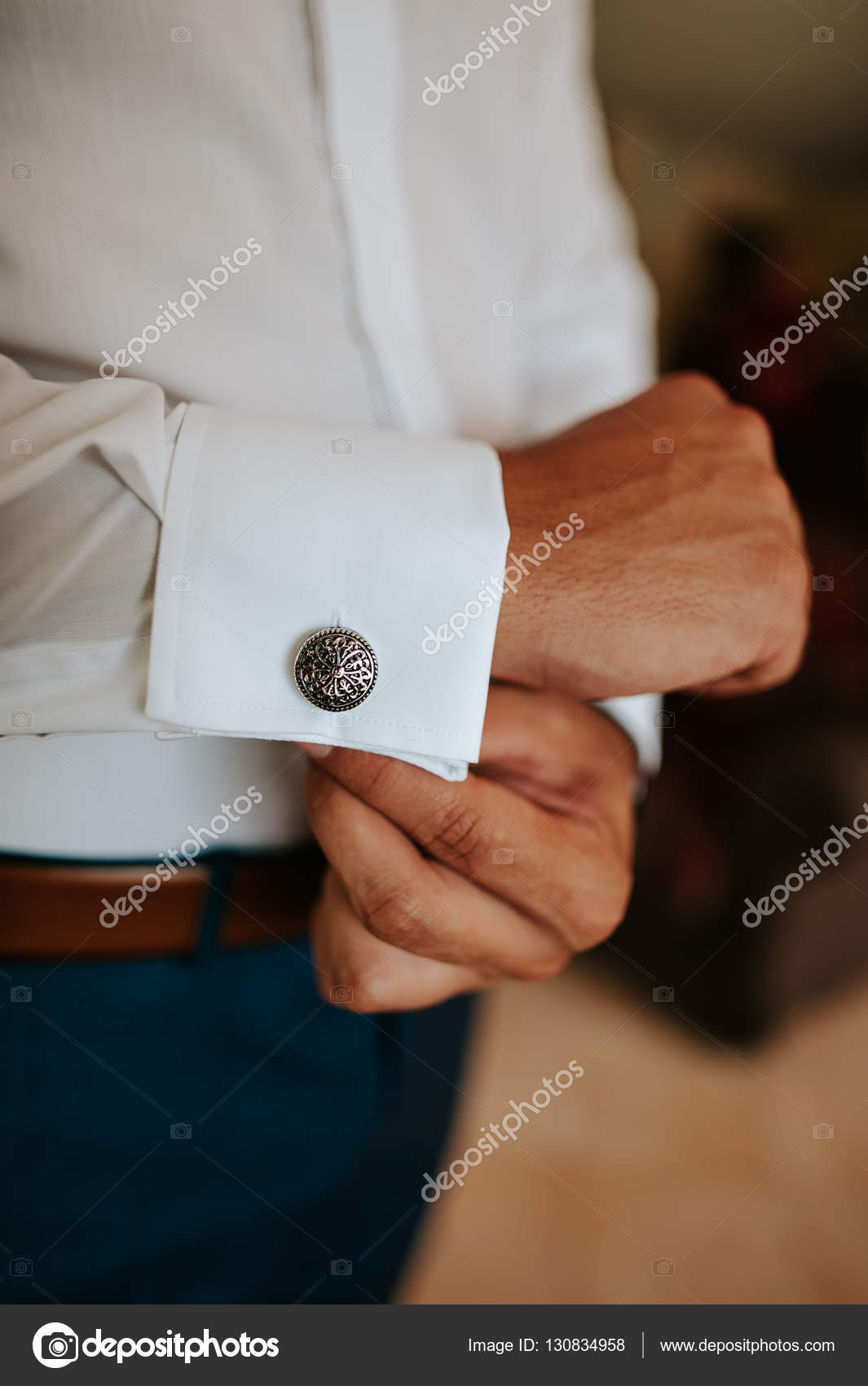Man putting on cuff-links Stock Photo by ©vladteodor95 130834958