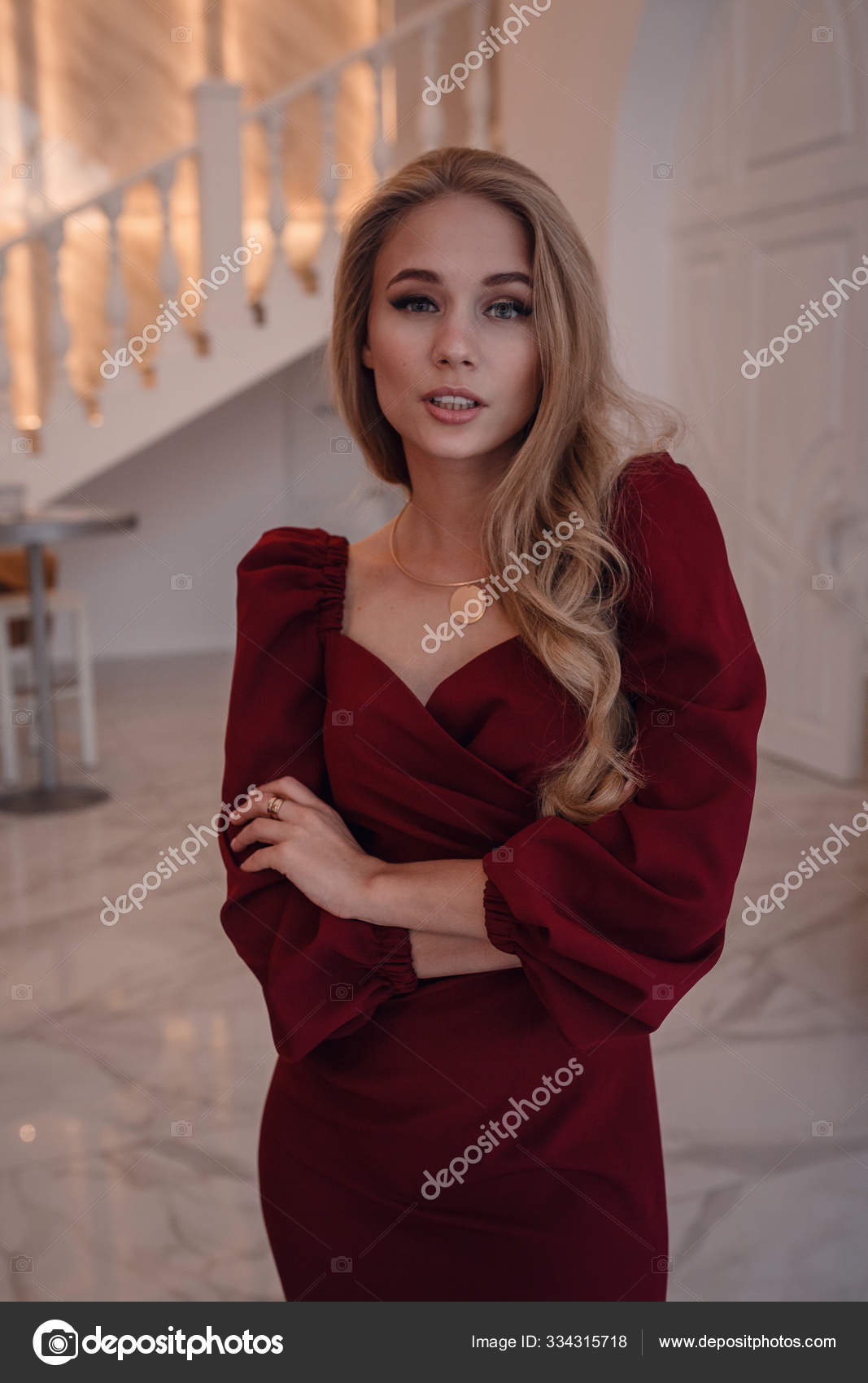 Romantic portrait of elegand blond woman waiting for someone in a ...