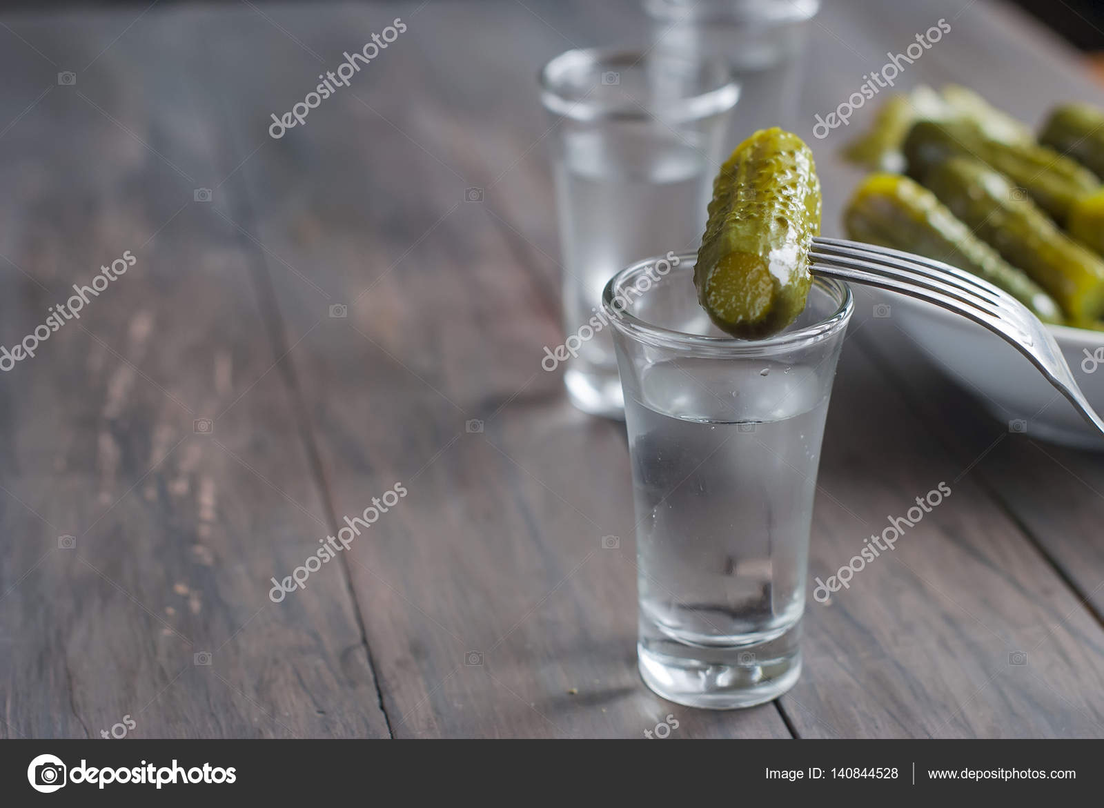 Small glass with Russian vodka and salt cucumber — Stock Photo © vi ...