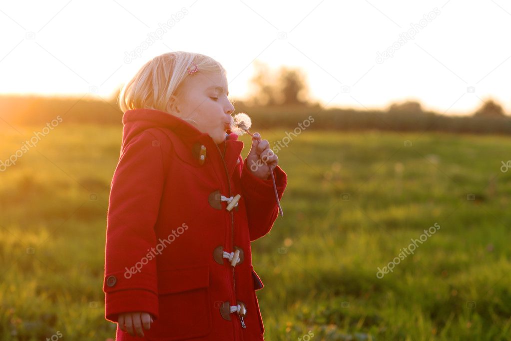 Little girl outdoors at sunset Stock Photo by ©CroMary 126834100
