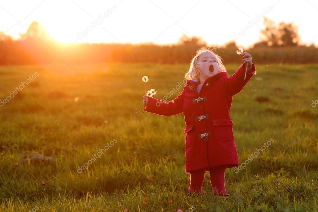 Little girl outdoors at sunset Stock Photo by ©CroMary 126834150