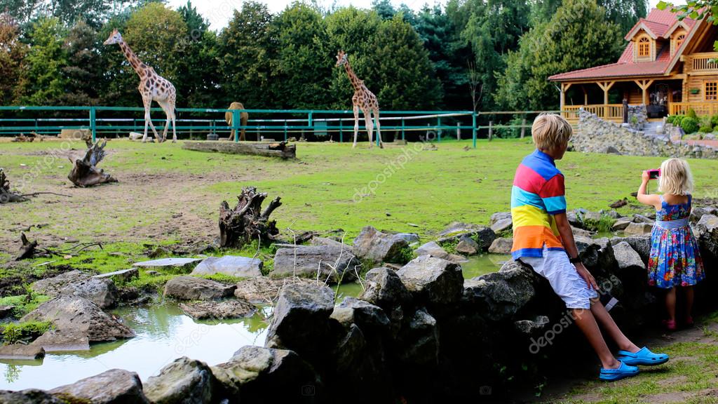 Family enjoying day at the zoo — Stock Photo © CroMary #126834738