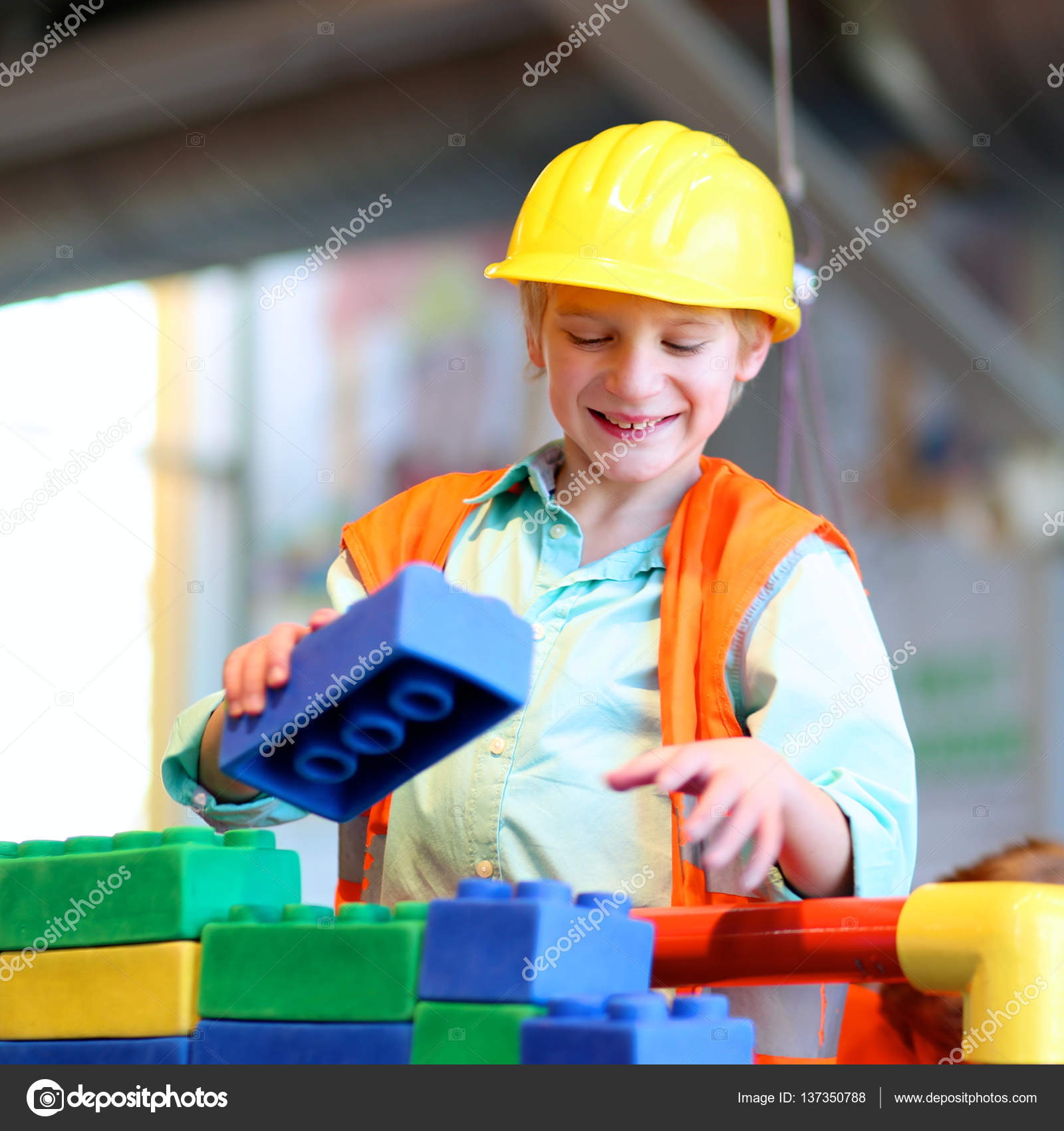 School boy playing with big building bricks – Stock Editorial Photo ...
