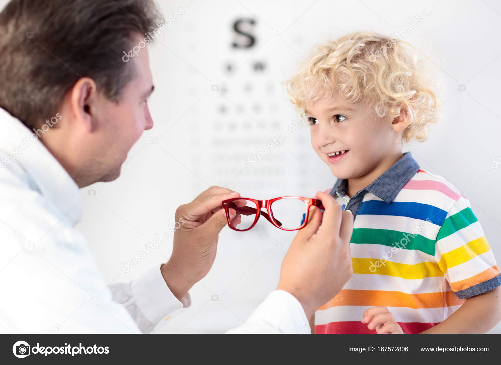 Child at eye sight test. Kid at optitian. Eyewear for kids. Stock Photo ...