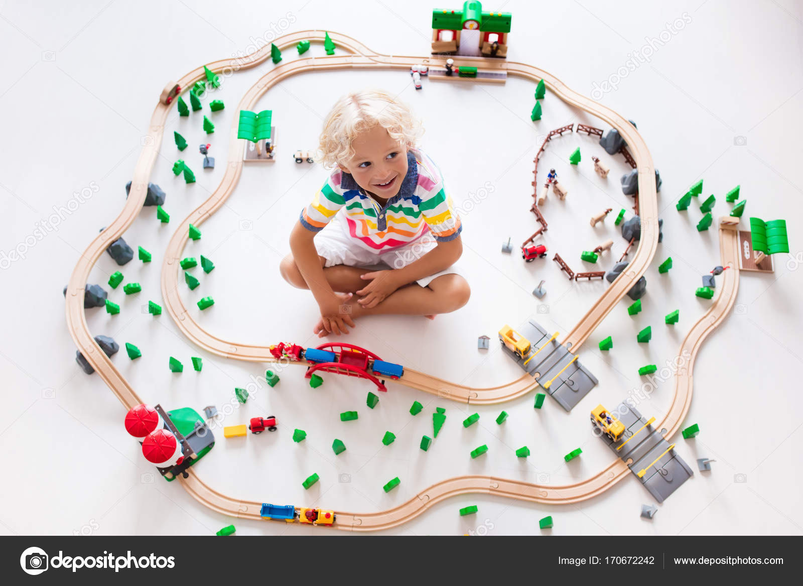 Child with toy train. Kids wooden railway. Stock Photo by ©FamVeldman ...