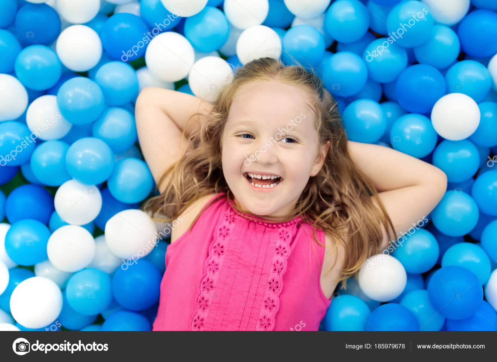 Kids play in ball pit. Child playing in balls pool Stock Photo by ...