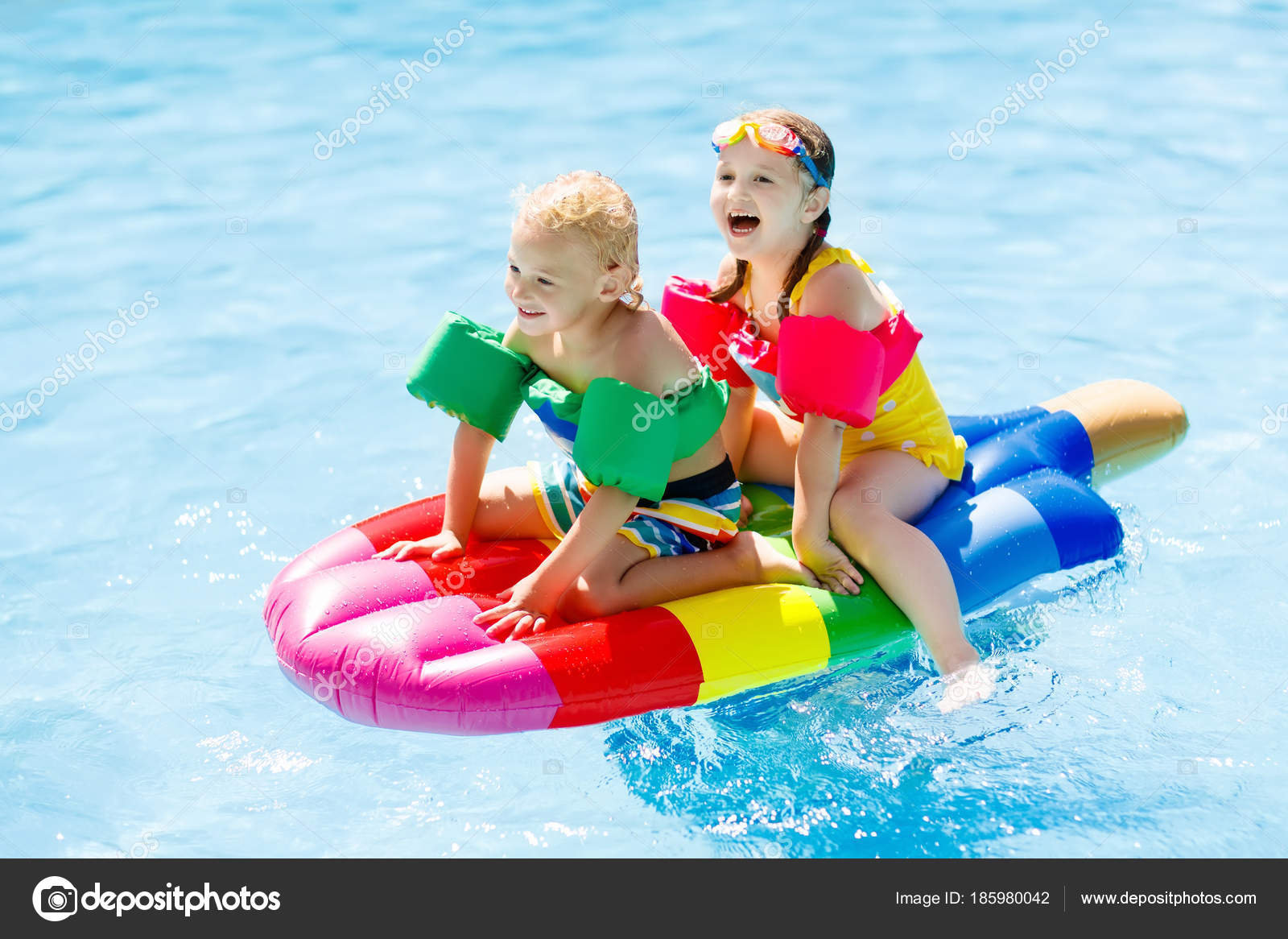 Kids on inflatable float in swimming pool. Stock Photo by ©FamVeldman ...