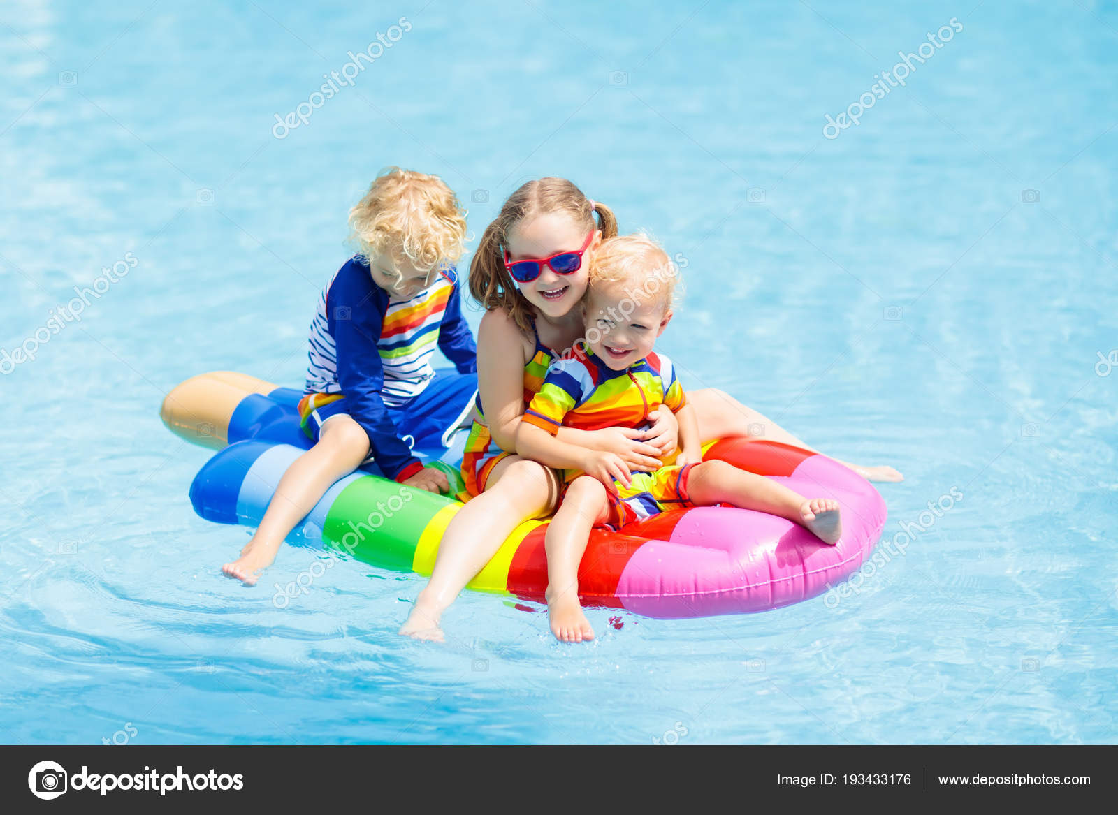 Kids on inflatable float in swimming pool. Stock Photo by ©FamVeldman ...