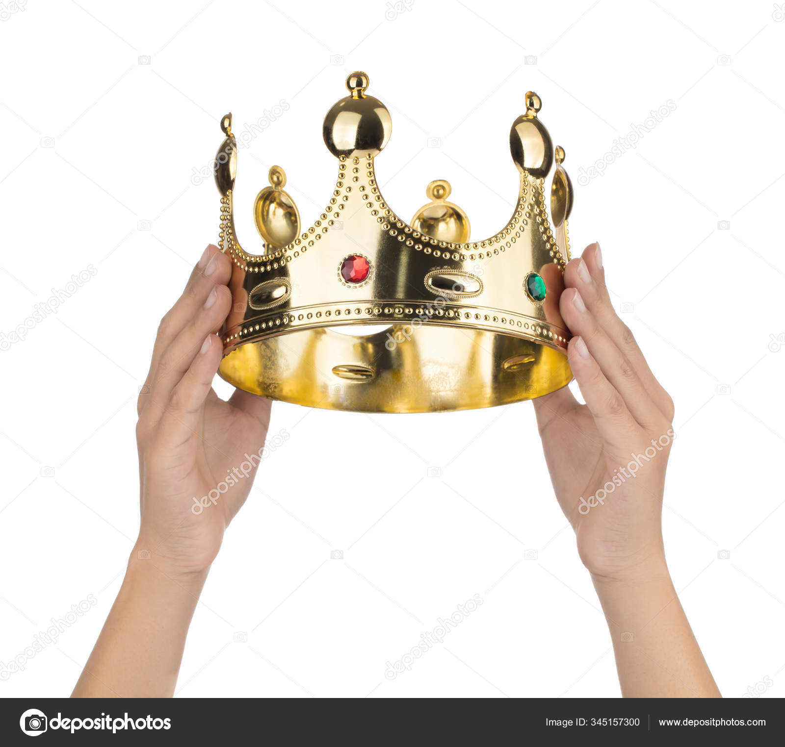 Hand holding Gold Crown with jewel isolated isolated on white ba ...