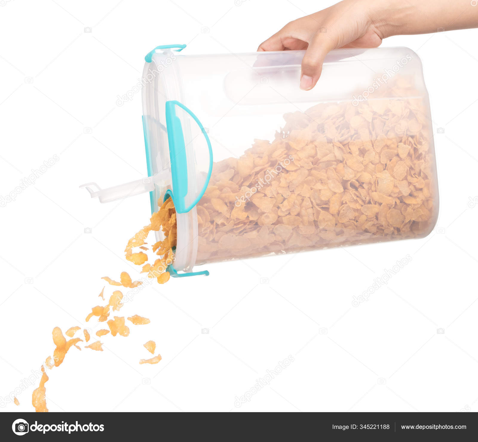Hand pouring cereals from container box isolated on white backgr ...