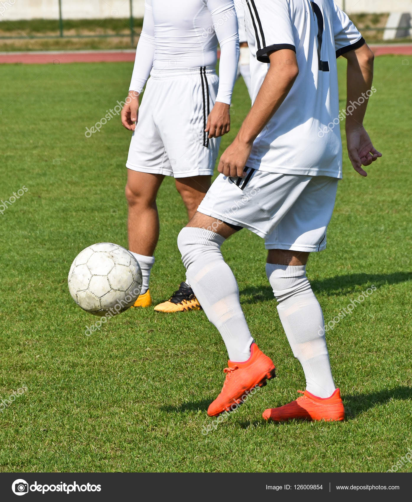 Soccer players with a ball Stock Photo by ©majorosl66 126009854