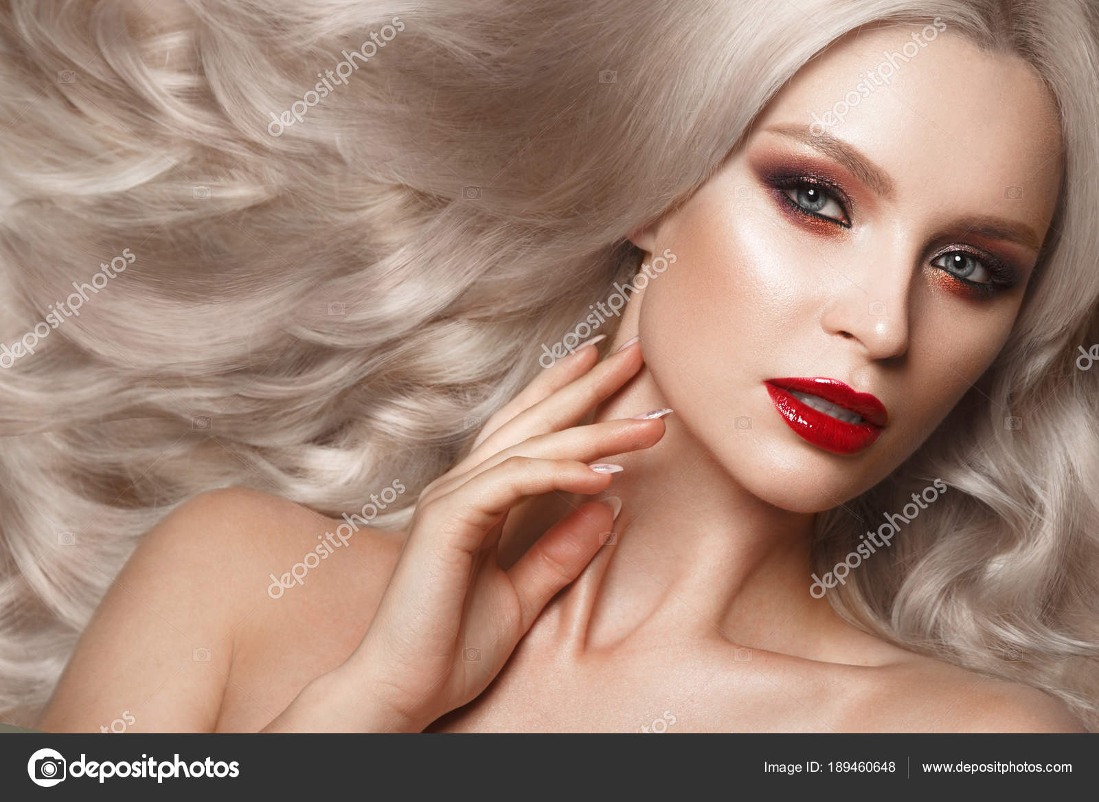 Beautiful Blonde In A Hollywood Manner With Curls Natural Makeup And