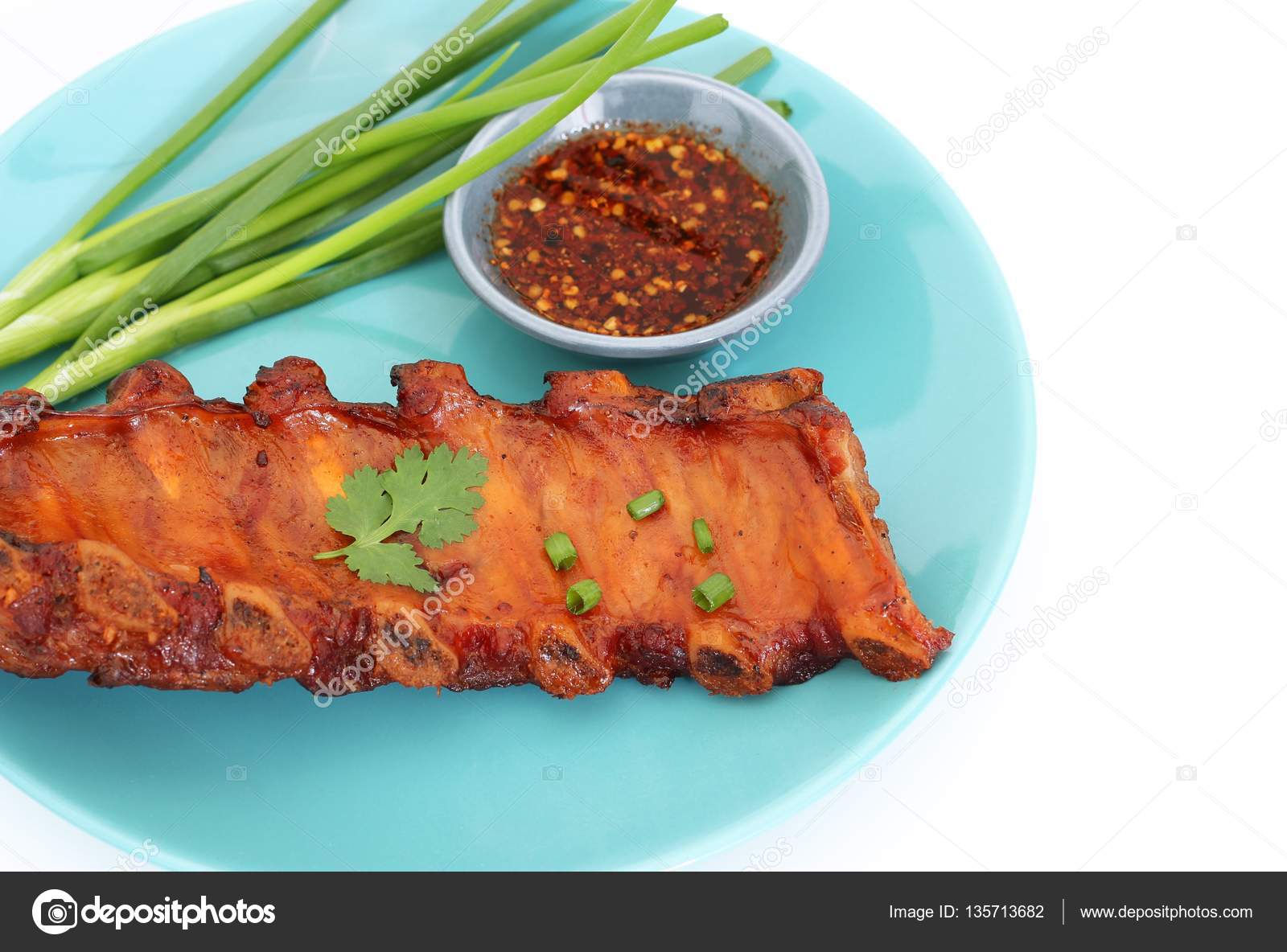 Grilled BBQ pork ribs on plate — Stock Photo © Gap #135713682