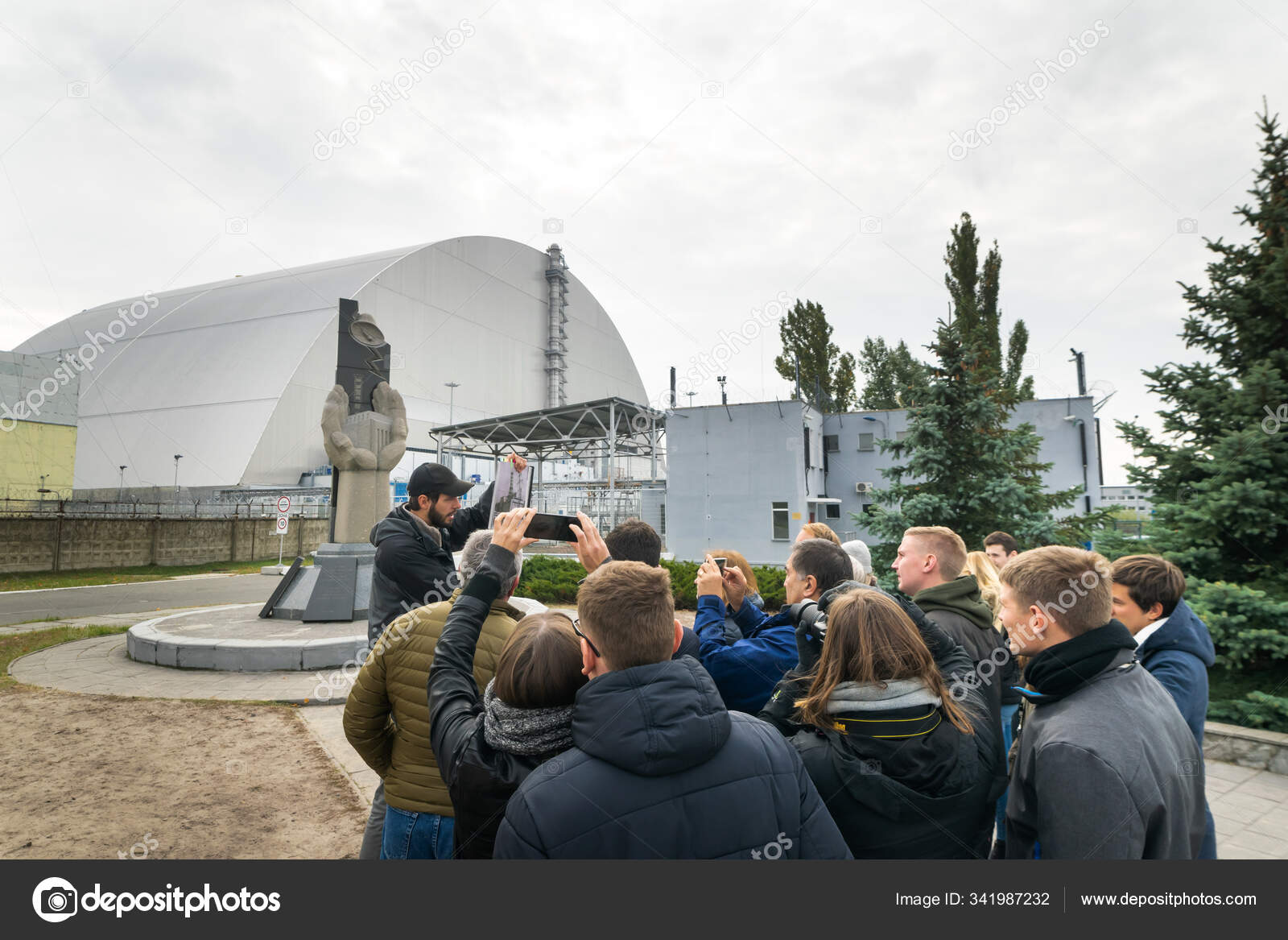 Male Guide Front Chernobyl Memorial Showing Photo Nuclear Power Reactor ...