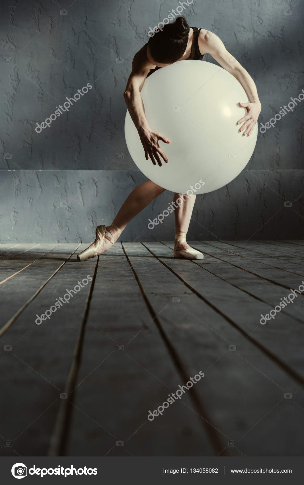 Flexible woman dancing using the white balloon Stock Photo by ...