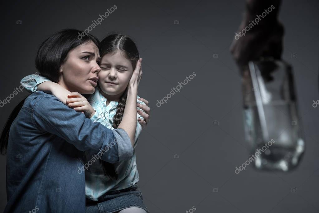 Scared mother embracing her little daughter — Stock Photo © yacobchuk1 ...