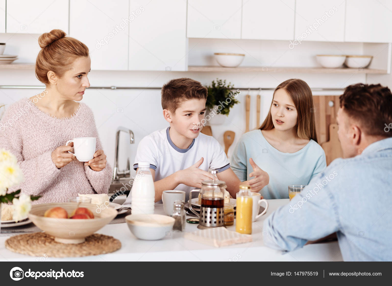 Pleasant family having lively conversation Stock Photo by ©yacobchuk1 ...