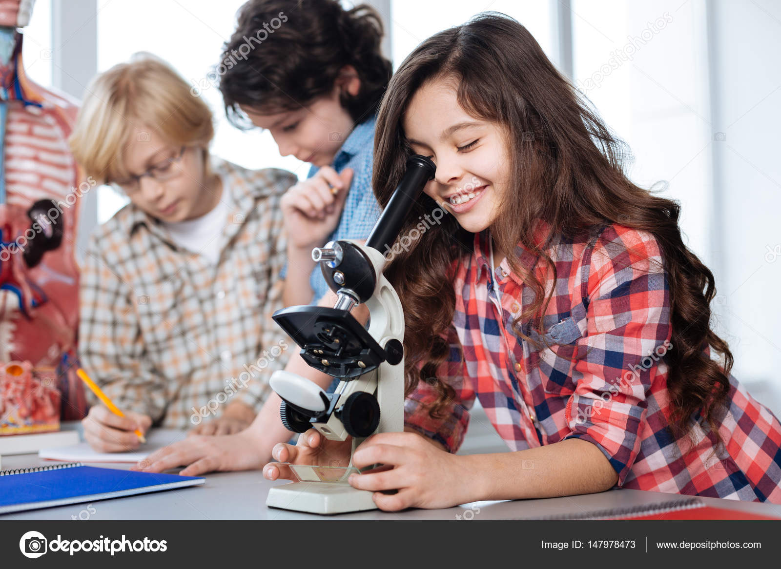 Cute active classmates enjoying biology — Stock Photo © yacobchuk1 ...