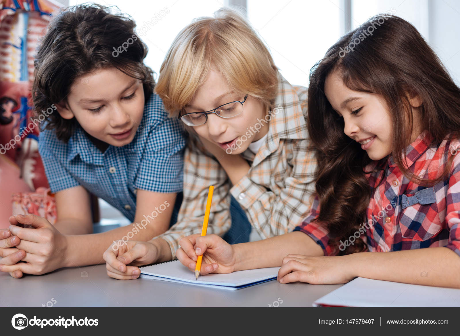 Engaged sociable kids discussing something Stock Photo by ©yacobchuk1 ...