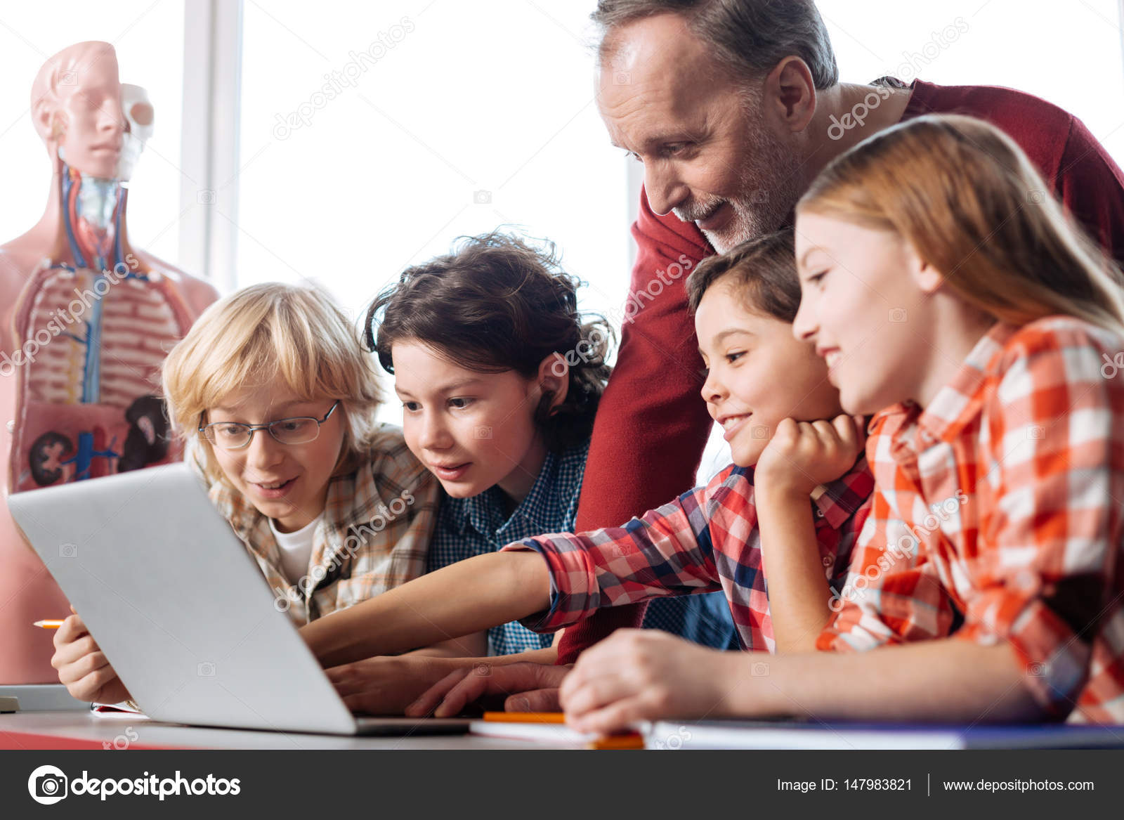 Active persistent students watching videos in class Stock Photo by ...