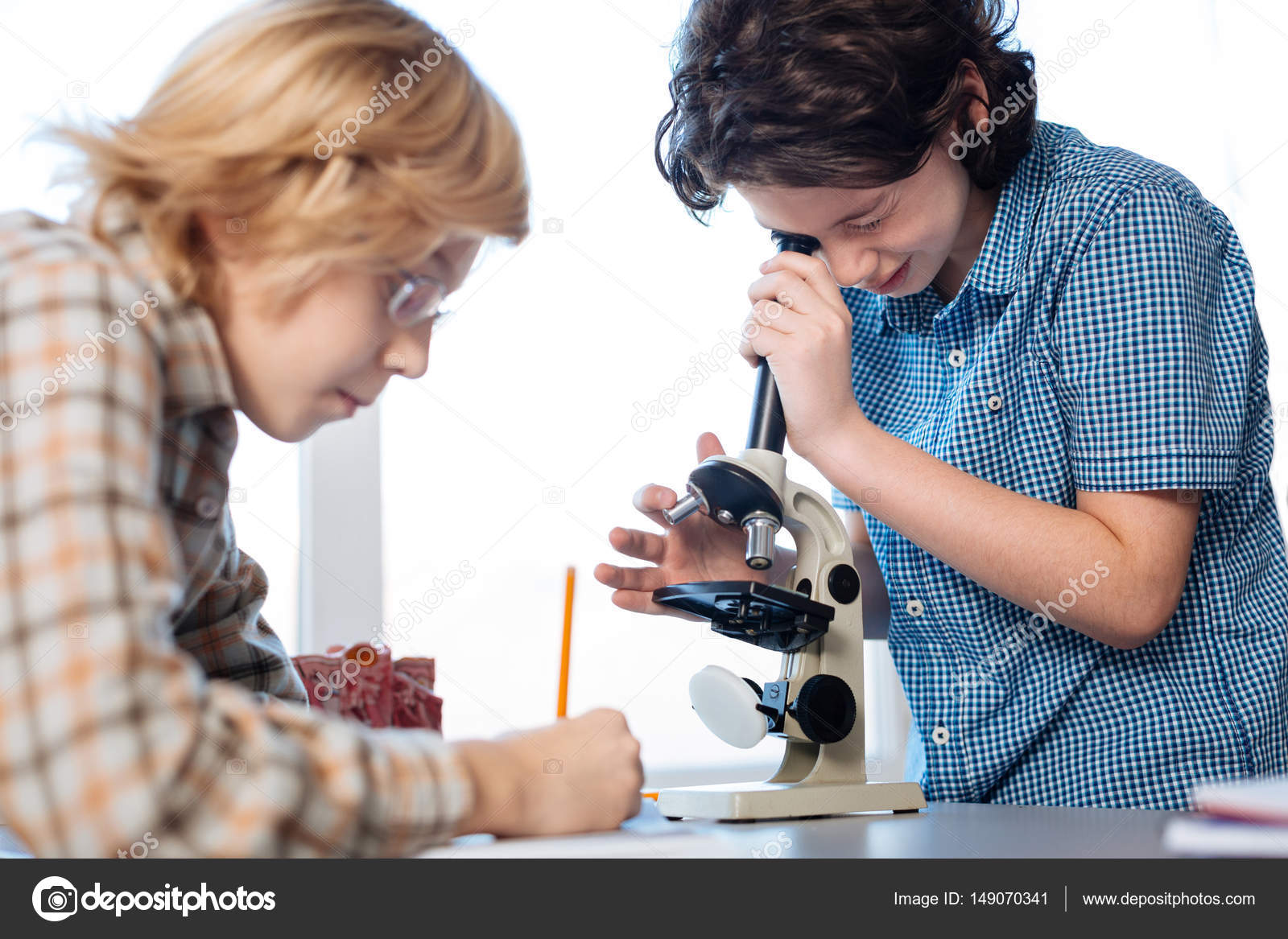 Curious future scientists exploring micro worlds Stock Photo by ...