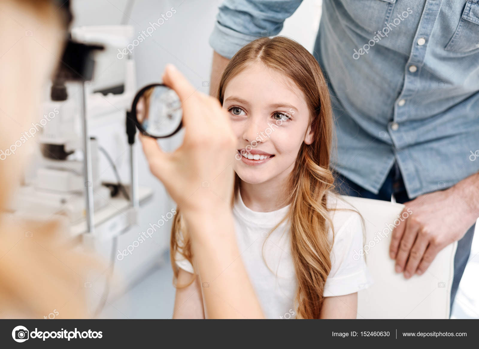 Focused clever child undergoing a checkup — Stock Photo © yacobchuk1 #152460630