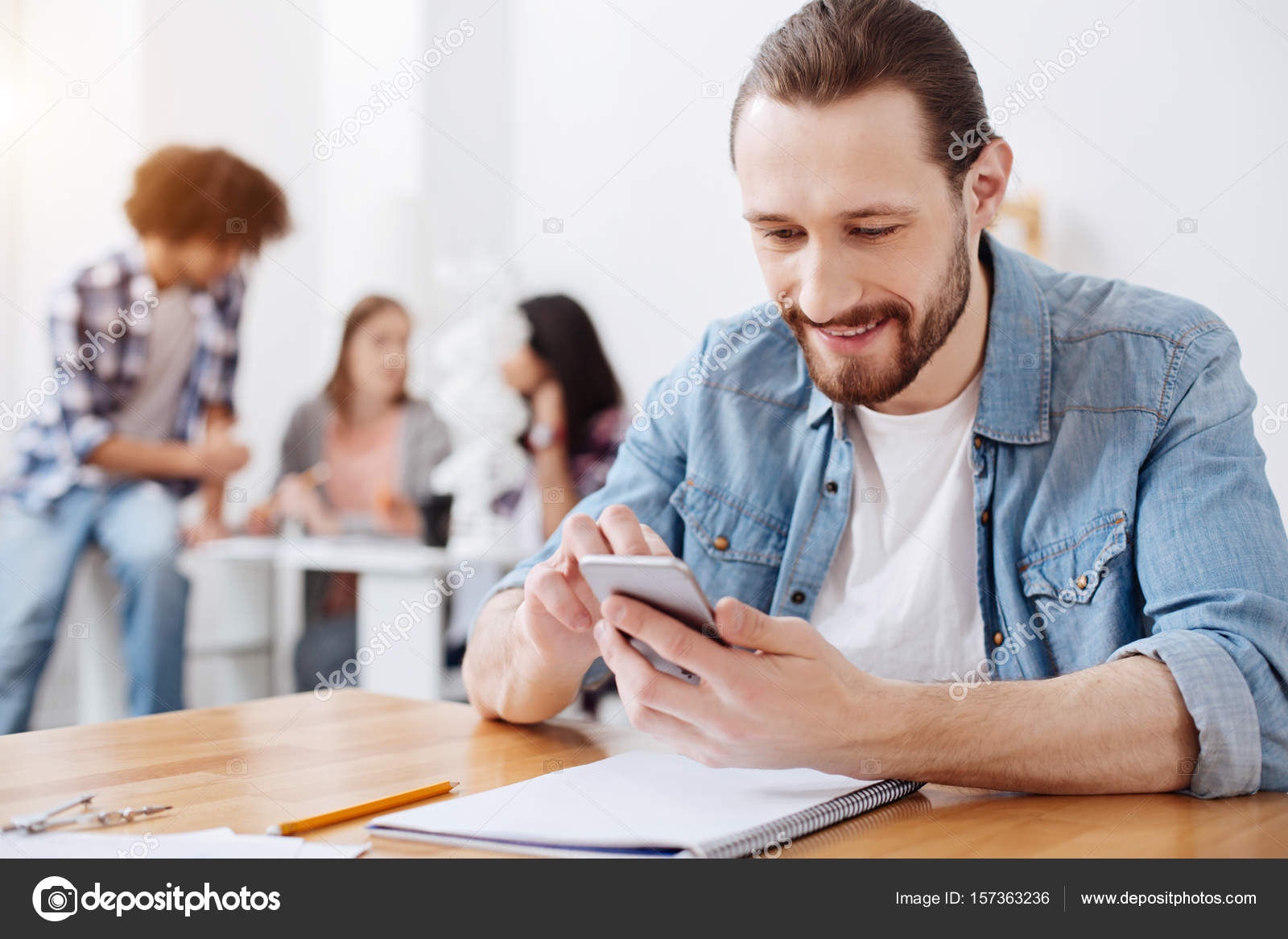 Sociable charismatic man chatting with friends online Stock Photo by ...