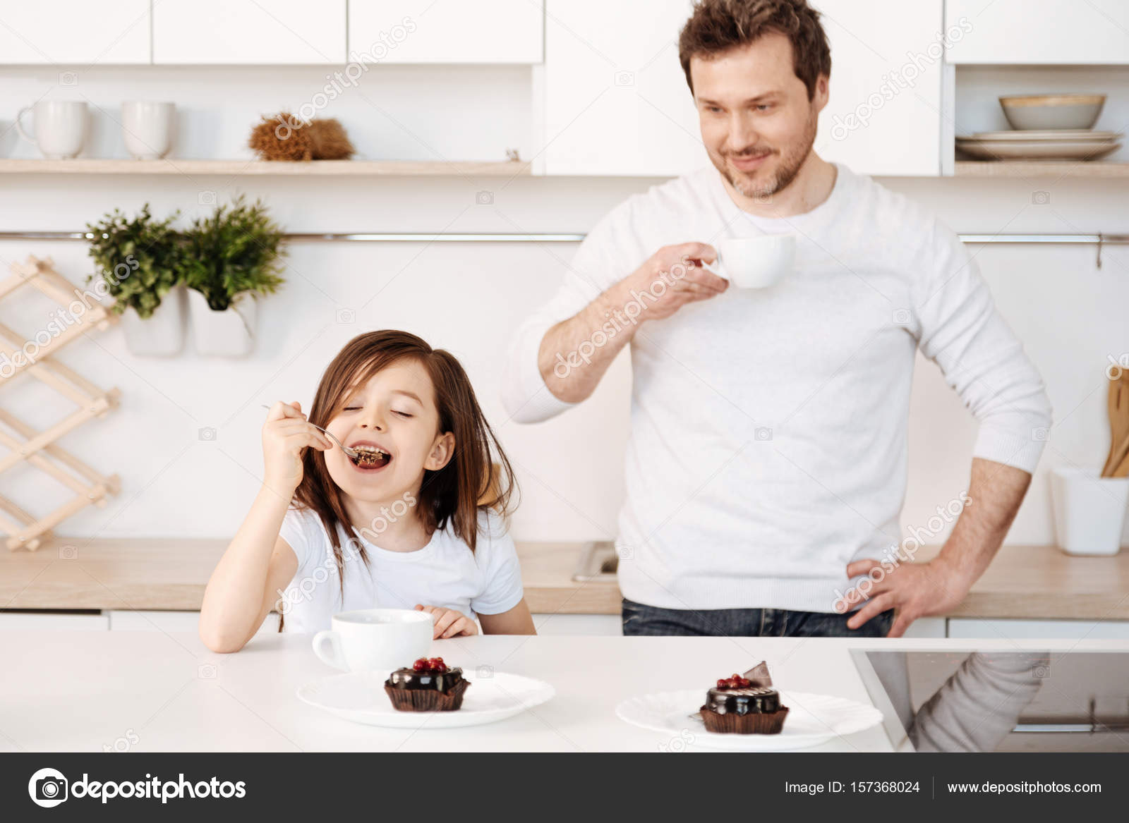 Little girl enjoying her cake Stock Photo by ©yacobchuk1 157368024