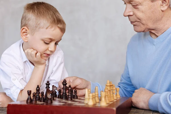Determined intelligent man explaining rules of a game - Stock Image ...