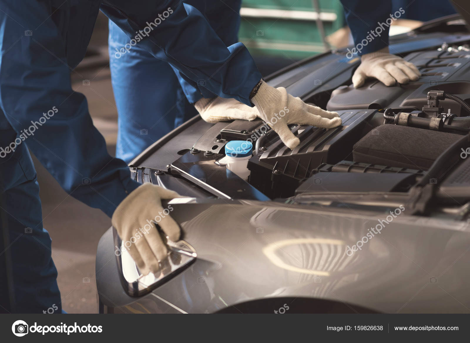 Two professionals examining cars engine — Stock Photo © yacobchuk1 ...