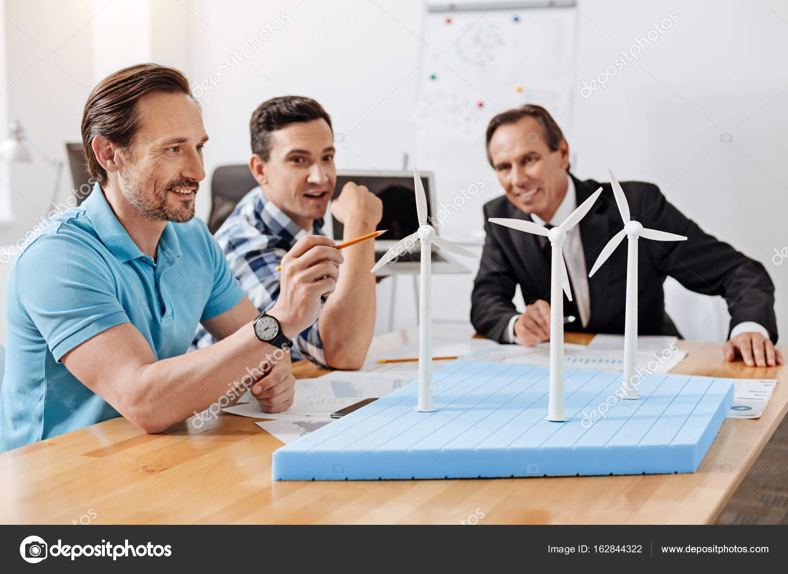 Young engineer explaining the basics of wind power station work Stock ...