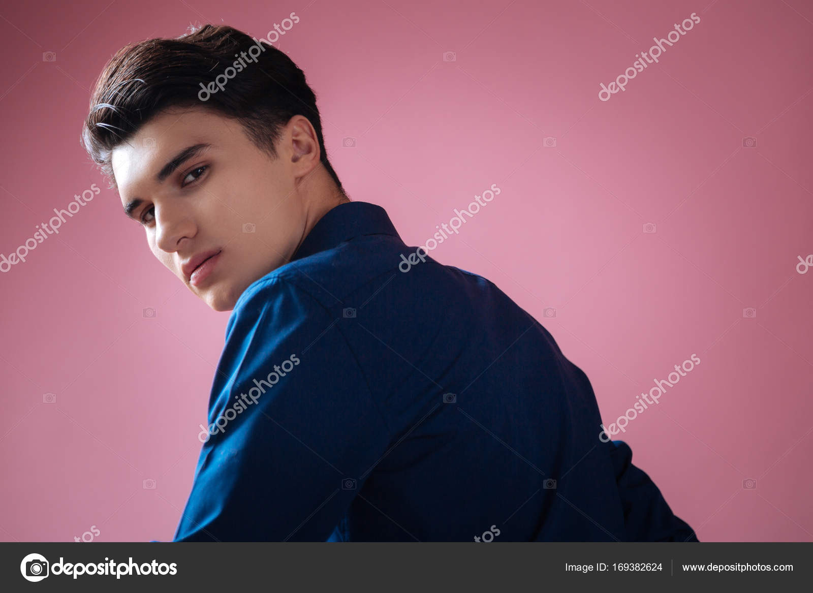 Gentle brunette man turning his head Stock Photo by ©yacobchuk1 169382624
