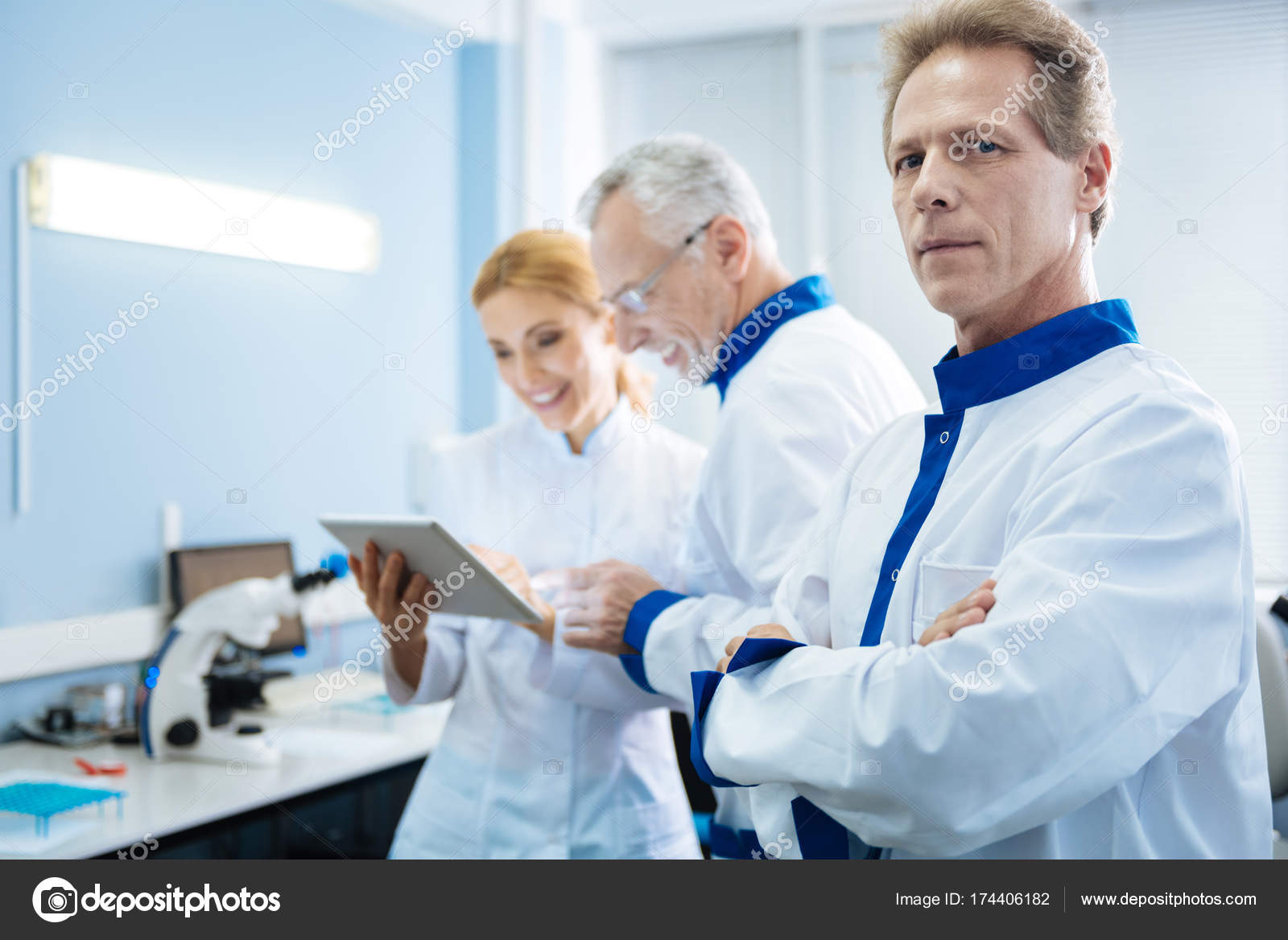 Happy people of science working in the lab — Stock Photo © yacobchuk1 ...