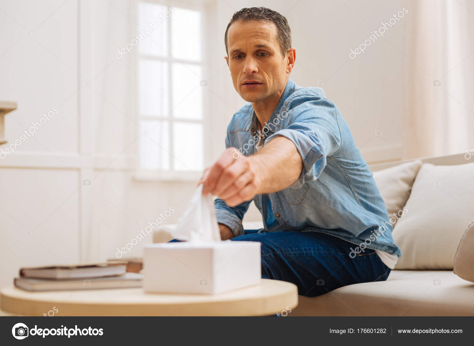 Crying sad man needs tissue Stock Photo by ©yacobchuk1 176601282